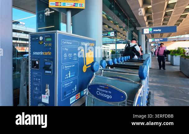 Chicago, USA, 7 May 2026: Luggage cart rental station outside airport ...
