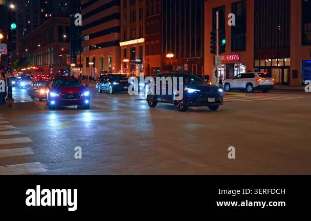 Chicago, USA, 7 May 2026: Night traffic at downtown intersection ...
