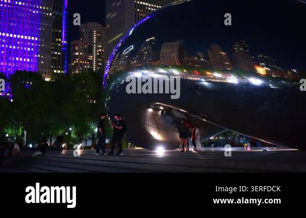 Chicago, USA, 7 May 2026: Illuminated skyscrapers reflected in polished ...