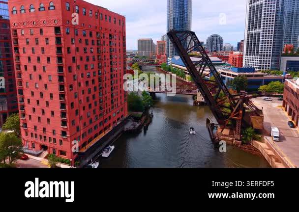 Approaching the red multi-storied building at the waterfront of the ...