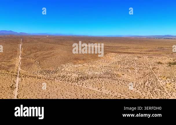 Flight over the dry hot desert on sunny clear day. Beautiful scenery of ...
