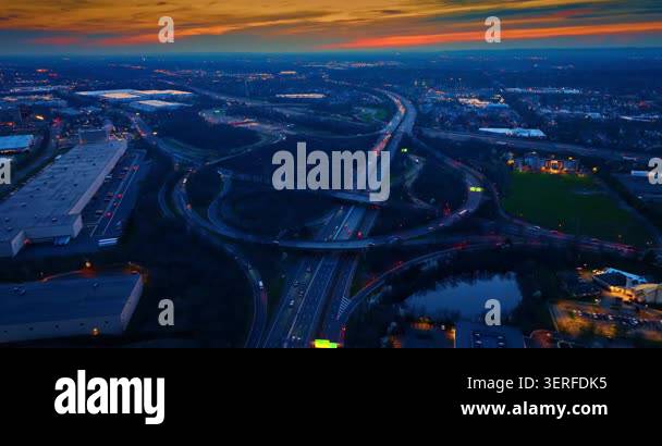 Aerial view of a road interchange next to a pond, United States. High ...