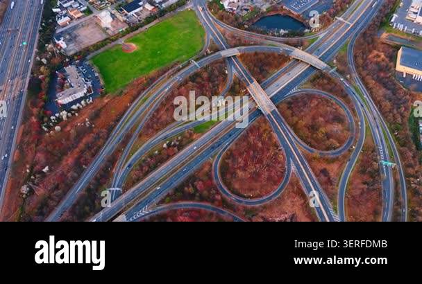 Overhead view of a cloverleaf highway junction in autumn. Top down ...