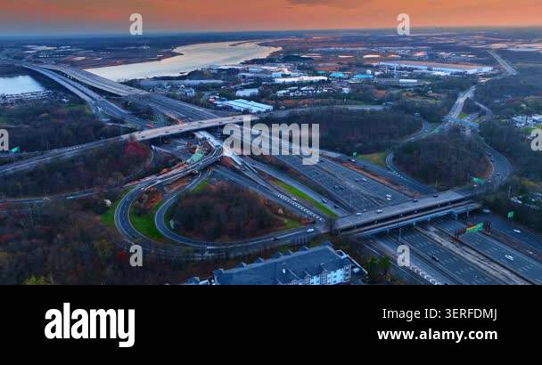 Wide highway interchange near a river, Woodbridge, New Jersey. Aerial ...