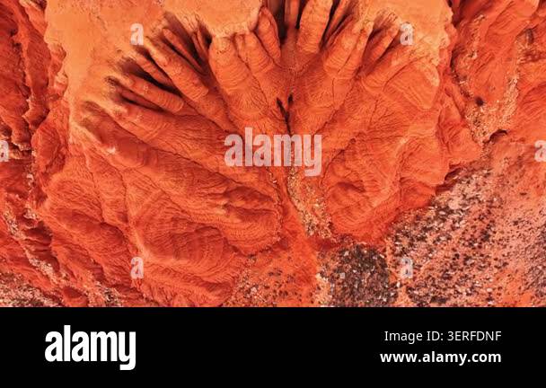 Drone view of branching red clay ridges and dry wash, Spain. Radiating ...