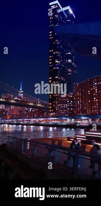 New York, USA, 8 May 2026: Pier boardwalk view of a modern skyscraper ...