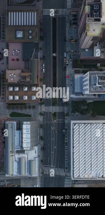 Top down city flying through downtown Los Angeles with skyscrapers and ...