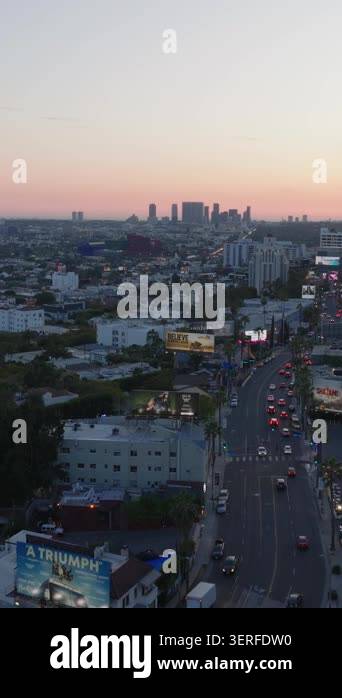 Aerial panoramic footage of large city at twilight. Fly above famous ...