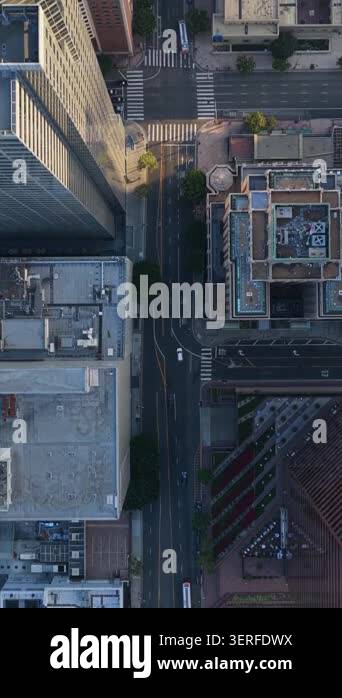 Top down aerial perspective flying over modern skyscrapers and urban ...