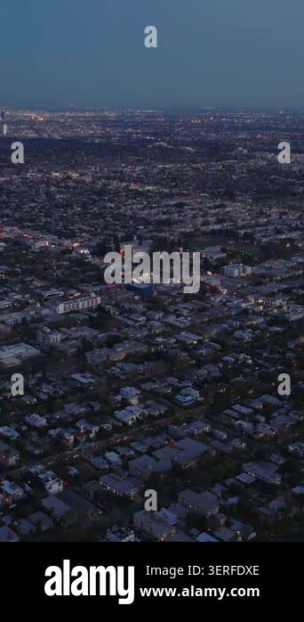 Fly above large city. houses in residential boroughs and high rise ...