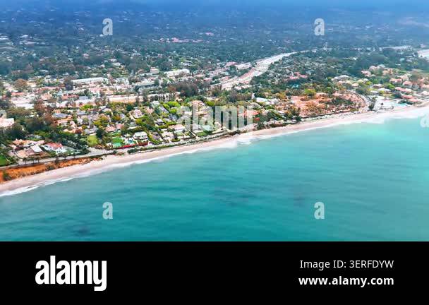 Approaching shore of American Riviera on sunny day. Cityscape of Santa ...