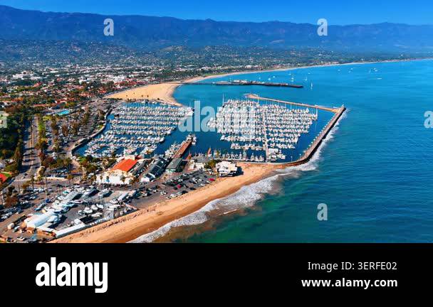 Shore of the Pacific Ocean from drone footage. Waves roll to the sandy ...