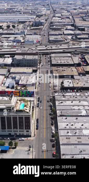 Urban landscape flying forward over industrial district with warehouses ...