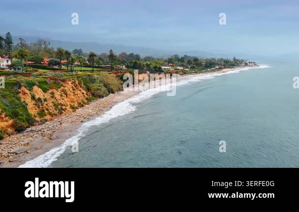 Sportsmen are paddle-boarding near the coast of Santa Barbara ...