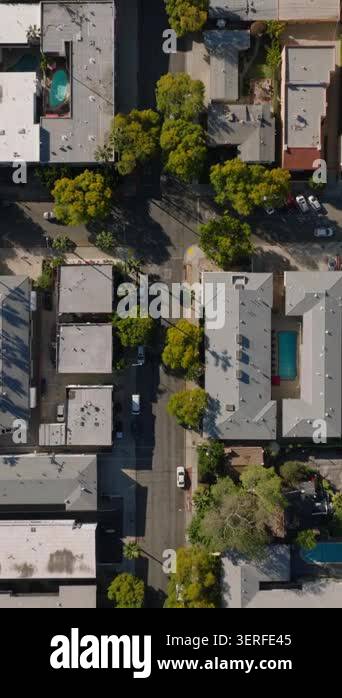 Top down panning shot of town development in metropolis. Houses and ...