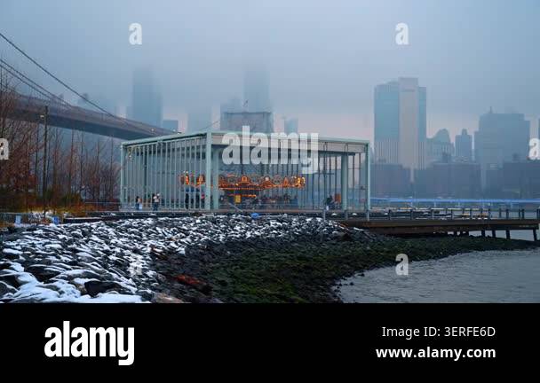 New York, USA, 25 December 2025: Vintage carousel inside glass building ...