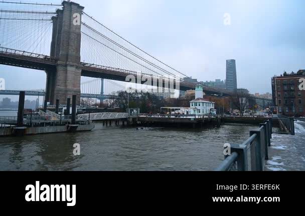 New York, USA, 25 December 2025: Waterfront pier with historic building ...