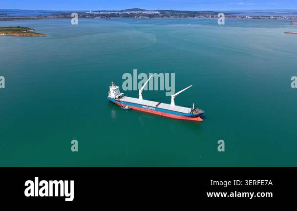 Burgas, Bulgaria, 10 April 2026: Bulk carrier with deck cranes anchored ...