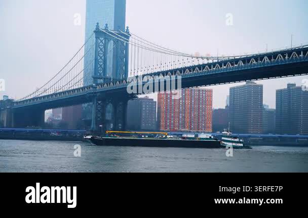 New York, USA, 25 December 2025: Industrial cargo barge and tugboat ...