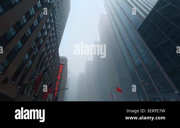 New York, USA, 12 January 2026: Sixth Avenue stretching toward fog past ...