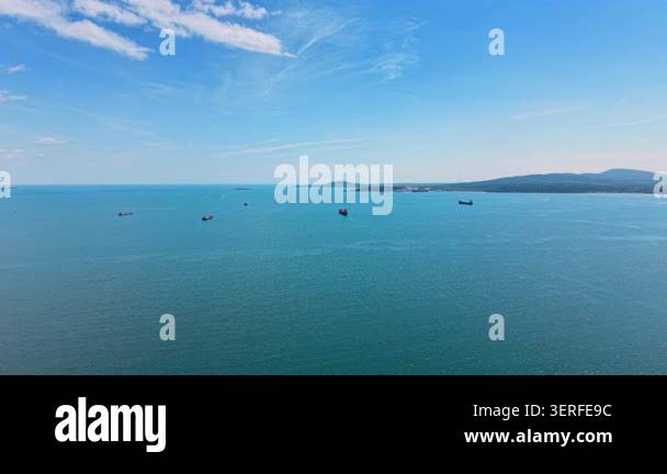 Wide seascape with cargo ships and mountainous island, Black Sea ...