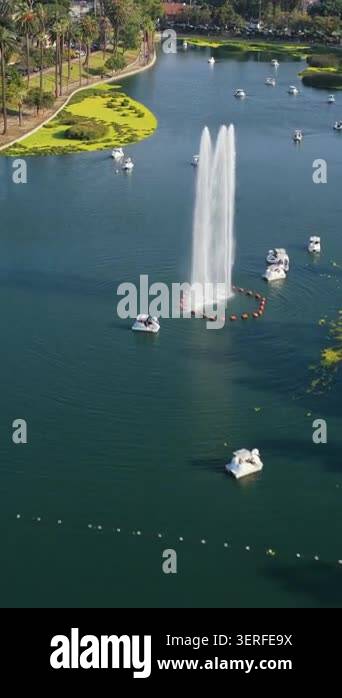 Scenic flight above Echo Park Lake featuring paddle boats, central ...