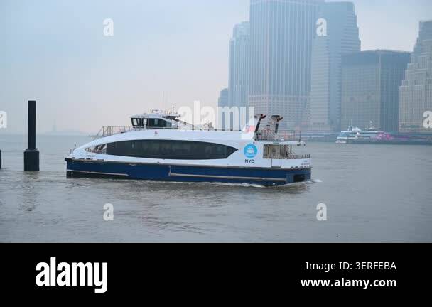 New York, USA, 25 December 2025: Passenger ferry boat on the East River ...