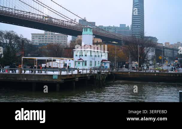 New York, USA, 25 December 2025: Ferry house under Brooklyn Bridge, New ...