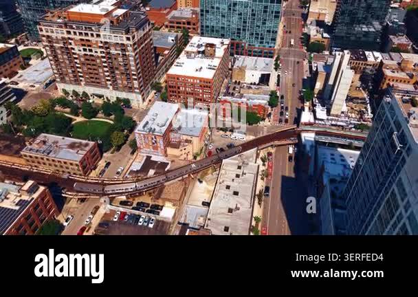Approaching the train moving by the railway through the urban landscape ...