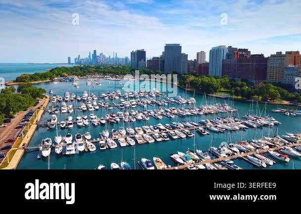 Footage over the harbor surrounded by lush greenery. Skyline of ...