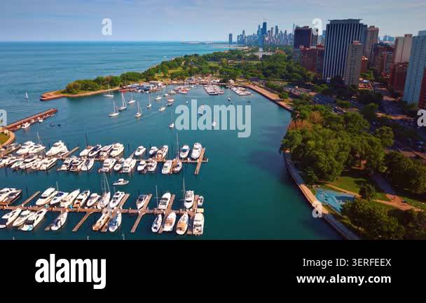Beautiful harbor with vessels at Lake Michigan. Rising over the shore ...