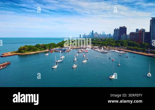 Sailboats at the blue waterscape and near the berths. Lake Michigan in ...