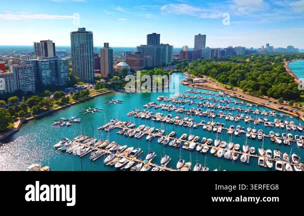 Harbor with numerous vessels surrounded by lush greenery. Beautiful ...