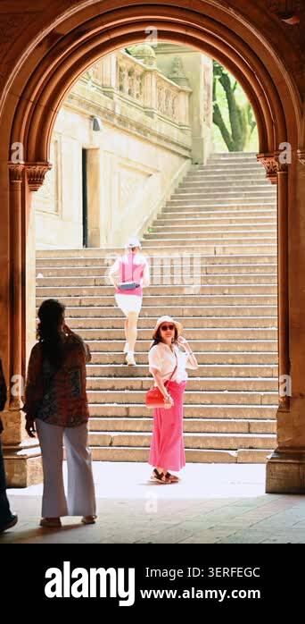 New York, USA, 22 May 2026: Woman posing under Bethesda Terrace archway ...