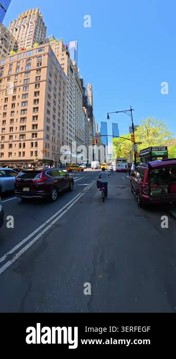 New York, USA, 22 May 2026: Cyclist riding through Midtown Manhattan ...