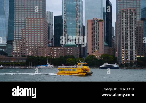 New York, USA, 22 May 2026: Yellow city ferry on the river in New York ...