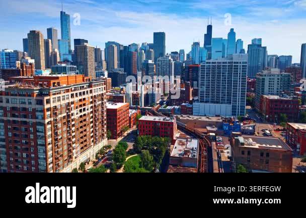 Trains move by the railways towards each other. High-rise downtown ...