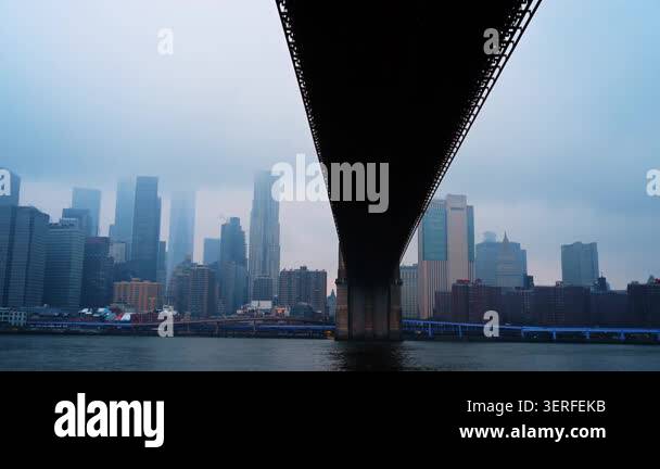 New York, USA, 25 December 2025: Brooklyn Bridge underside with foggy ...