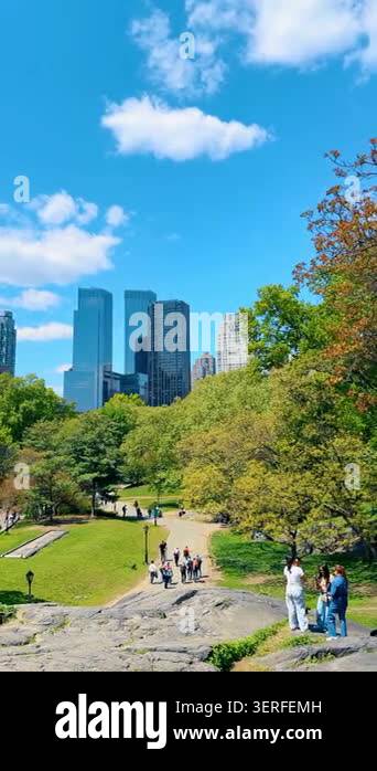 New York, USA, 22 May 2026: Central Park green lawn and path with ...