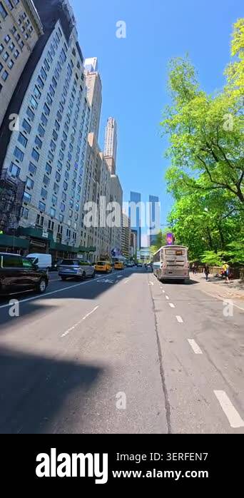 New York, USA, 22 May 2026: Midday traffic on Central Park South avenue ...