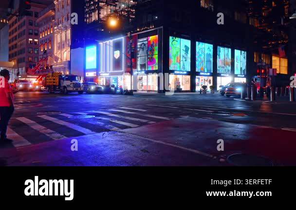 New York, USA, 5 November 2025: Neon lit storefronts and art gallery on ...