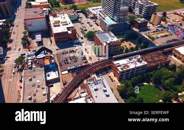 Chicago, USA, 7 May 2026: Elevated train curving over intersection in ...