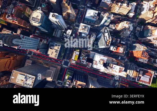 Flying high over the rooftops of high-rises and skyscrapers in ...