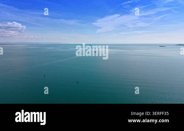 Wide seascape with distant cargo ship and navigation buoys, Burgas Bay ...