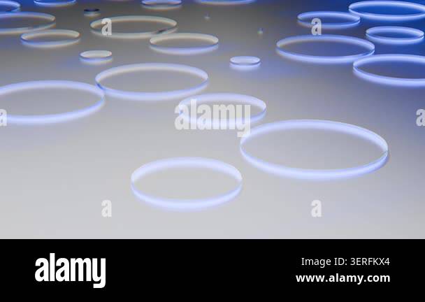 Abstract arrangement of translucent rings glowing in cool blue light ...