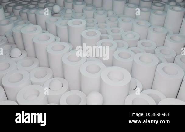 Dense white cylindrical shapes with circular openings fill the frame in ...