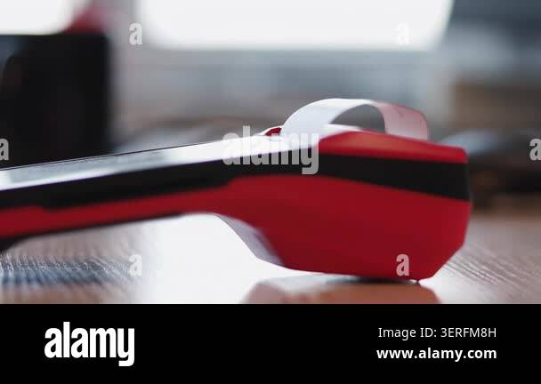 Red Tape Dispenser On Wood Desk, Shallow Focus On Curved Plastic Body ...