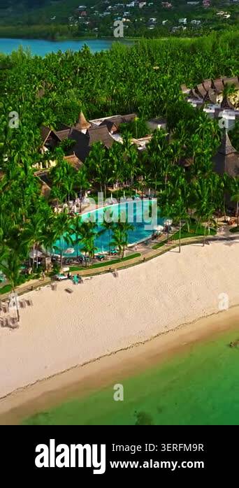 Aerial view of crystal water on the seashore, Mauritius with palm trees ...