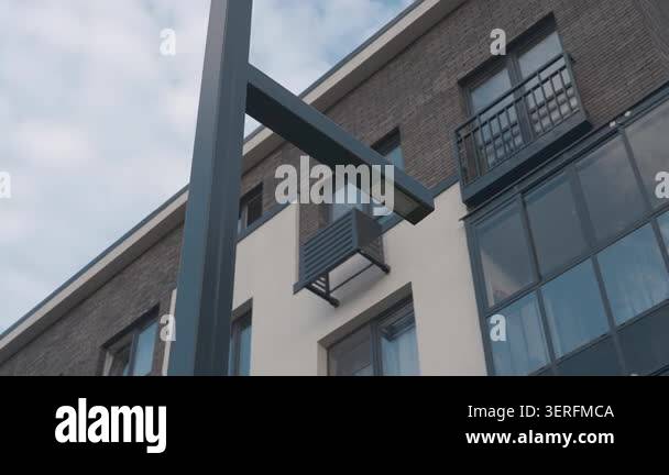 Low angle view of a contemporary residential building with dark brick ...