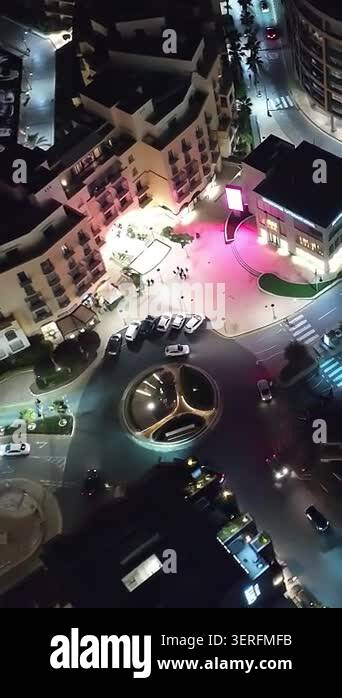 Aerial of night view of Paceville, St. Julians city with modern towers ...
